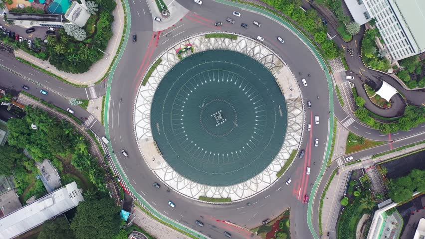 Aerial Birds Eye Overhead Top Down rotating View of busy city traffic ... Aerial Birds Eye Overhead Top Down rotating View of busy city traffic ...