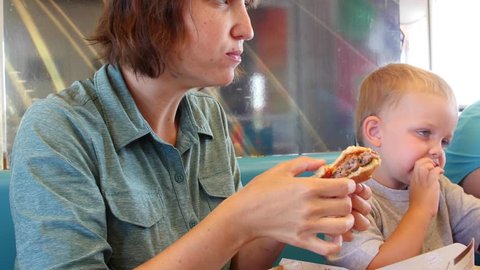 Young Mother Child Eating Hamburger On Stock Photo 669120064 | Shutterstock