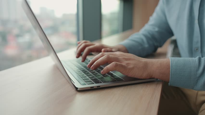 Fake VHS tape: a male employee at work in the office, typing at a PC's ...