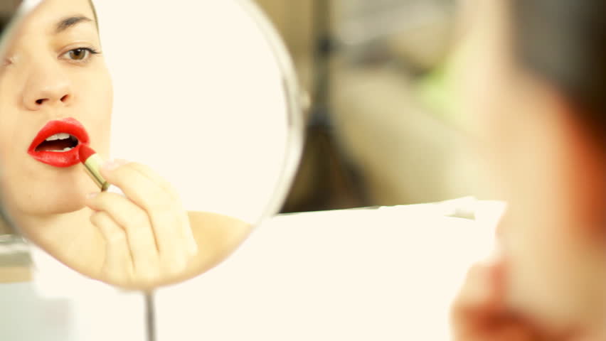 woman applying red lipstick mirror Stock Footage Video (100% Royalty ...