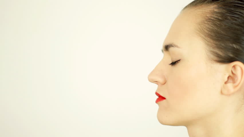 profile view young woman blowing kiss Stock Footage Video (100% Royalty ...