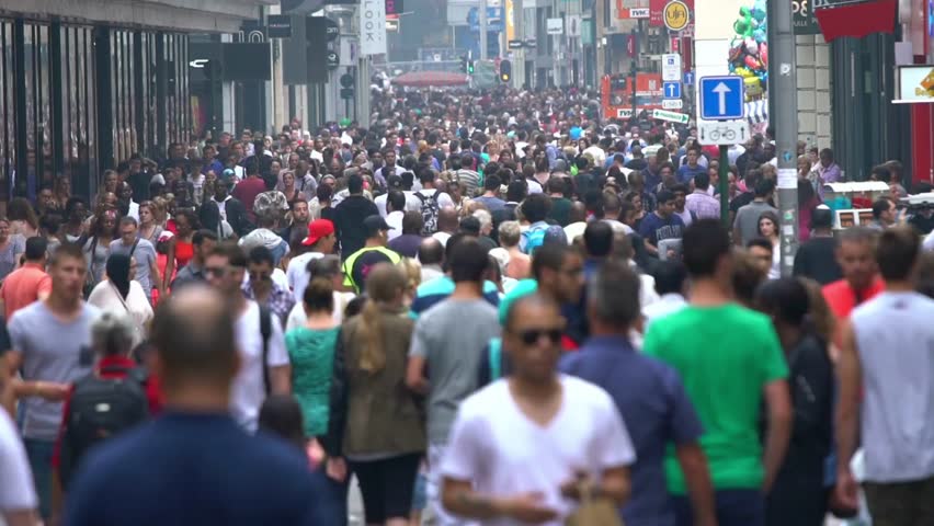 Crowd of anonymous people walking on busy city street in Barcelona ...
