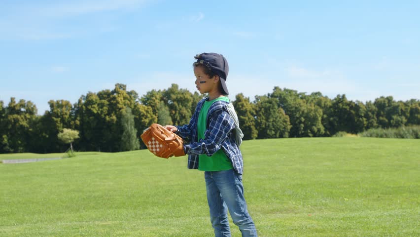 Baseball at school, the pitcher pitches fastball toward batter, young ...