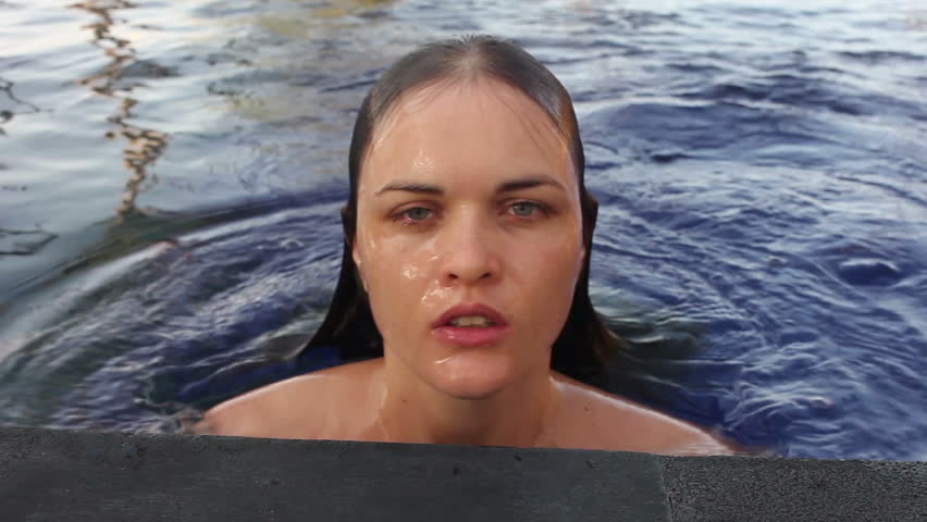 brunette woman emerges blue pool water Stock Footage Video (100% ...