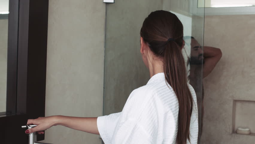woman standing bathroom man under shower Stock Footage Video (100% ...
