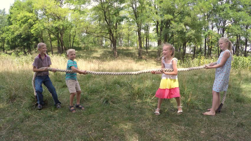 group happy school kids playing tug-of-war Stock Footage Video (100% ...
