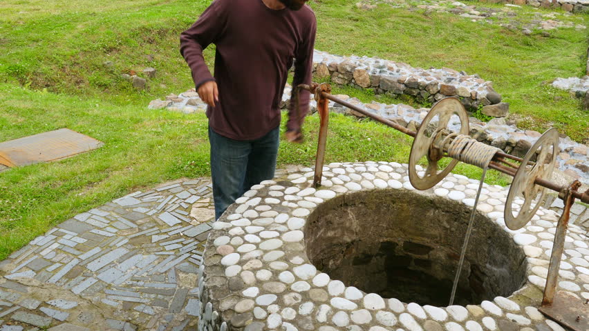 man taking water historical fountain well Stock Footage Video (100% ...