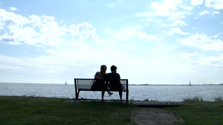 romantic coupe waterside bench silhouette Stock Footage Video (100% ...
