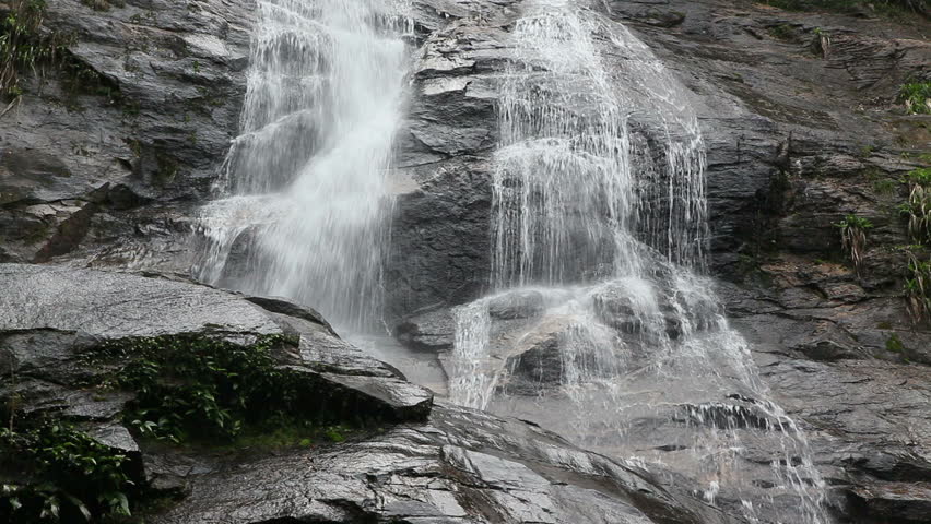 Water Falling Over a Rock Stock Footage Video (100% Royalty-free ...