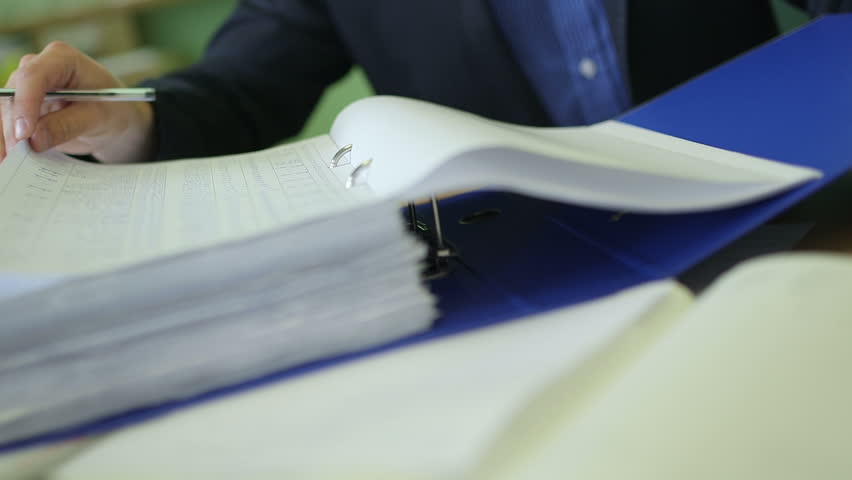 businessman examining documents desk medium shot Stock Footage Video ...