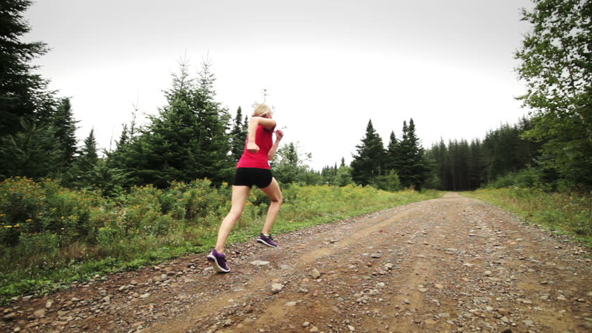 woman running lonely on gravel road Stock Footage Video (100% Royalty ...