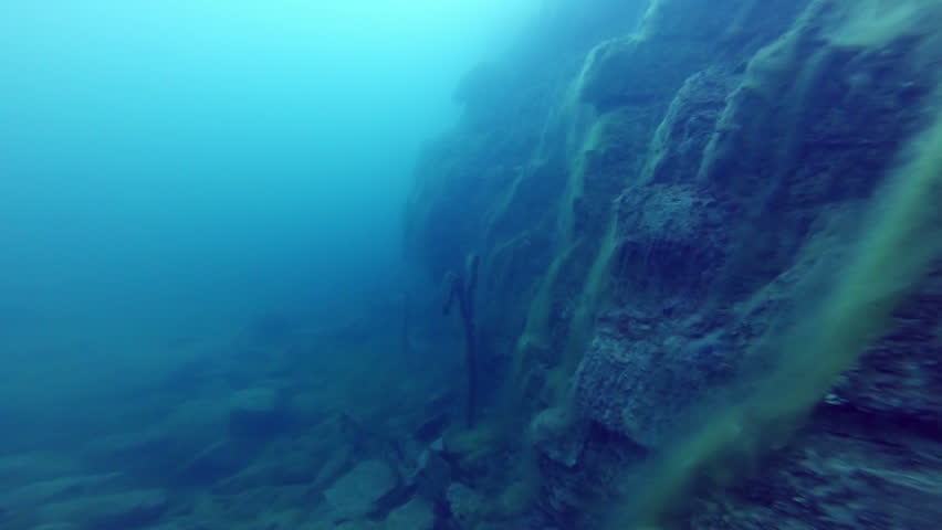 deep freediver exploring side underwater cliff Stock Footage Video (100 ...