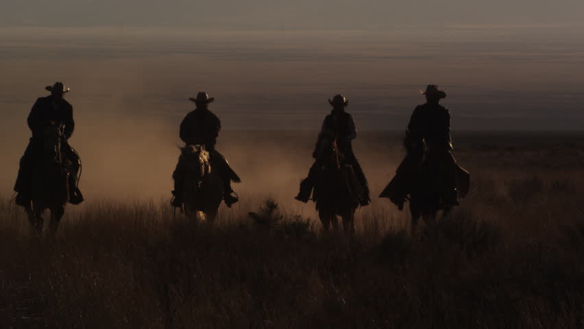 four cowboys riding horses dusk slowmotion Stock Footage Video (100% ...