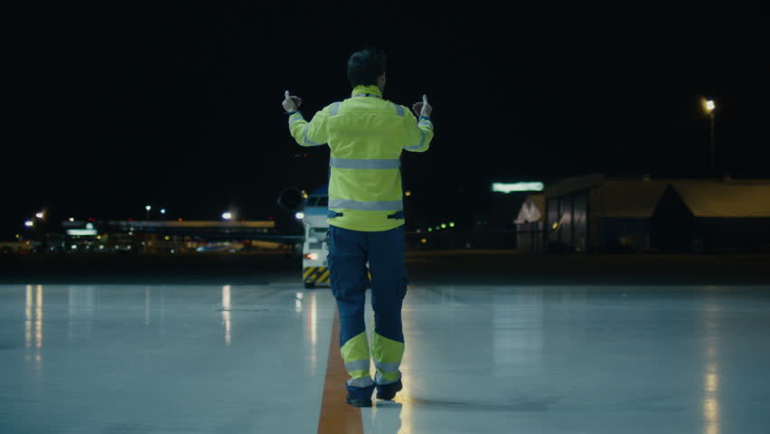 Aircraft Marshal Signals an Airplane Stock Footage Video (100% Royalty ...