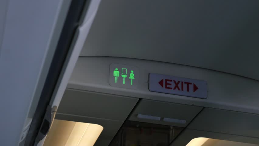 airplane's lavatory light turns occupied Stock Footage Video (100% ...