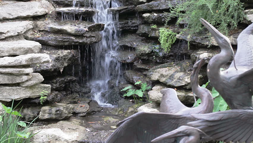 peaceful garden scene waterfall running by Stock Footage Video (100% ...