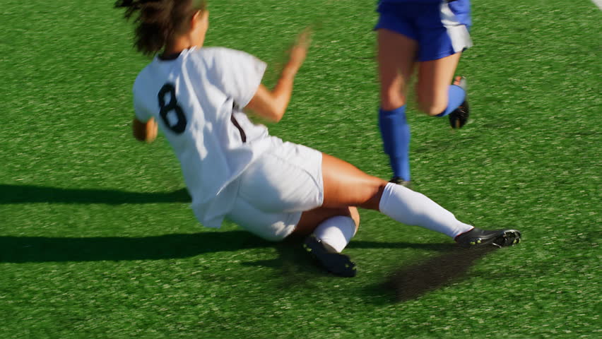 female soccer player slide tackles opponent Stock Footage Video (100% ...
