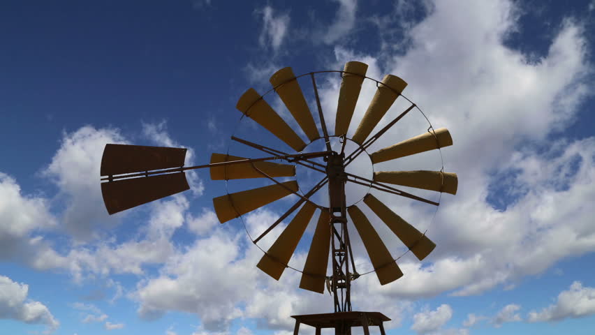 old ranch windmill on sky background Stock Footage Video (100% Royalty ...