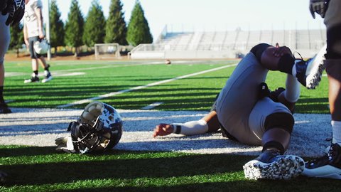 Football Player Stretches Before Game Stock Footage Video (100% Royalty ...