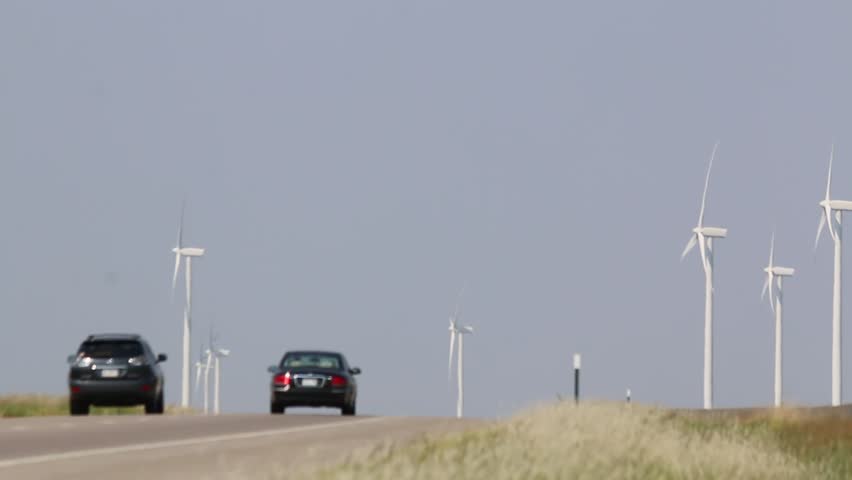 vehicles travel along interstate wind turbines Stock Footage Video (100 ...