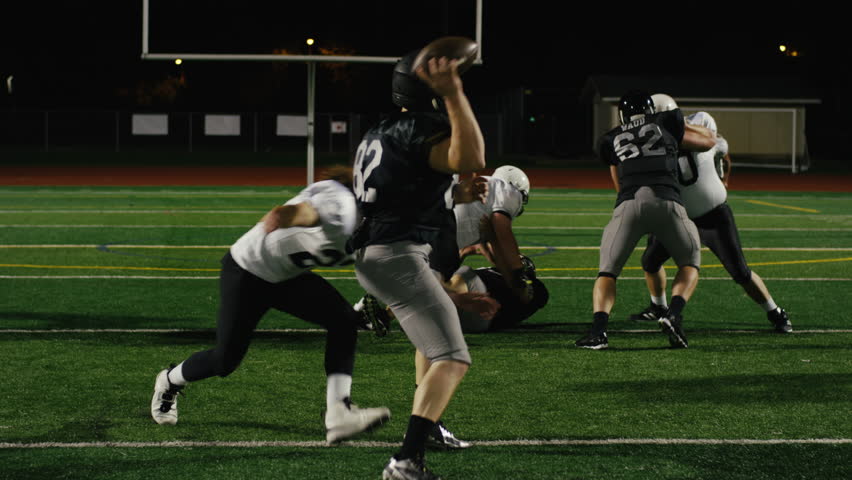 A Football Player Gets Tackled Stock Footage Video (100% Royalty-free ...