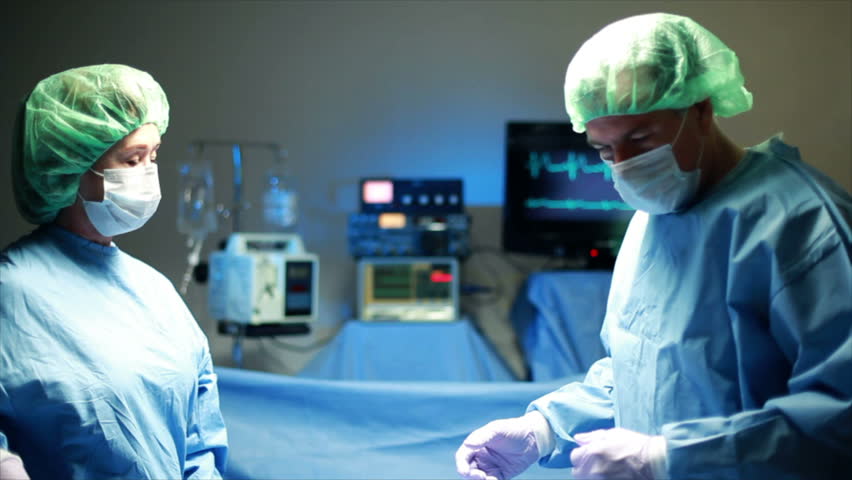 Two Surgeons Performing Surgery are Stock Footage Video (100% Royalty ...