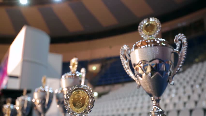 many trophy cups on stand before Stock Footage Video (100% Royalty-free ...