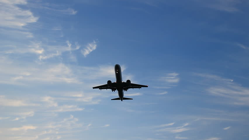 large jet airplane flying over runway Stock Footage Video (100% Royalty ...