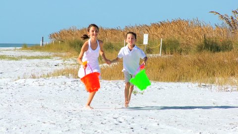 Two Little Kids Run Down Beach Stockvideoklipp (helt royaltyfria ...