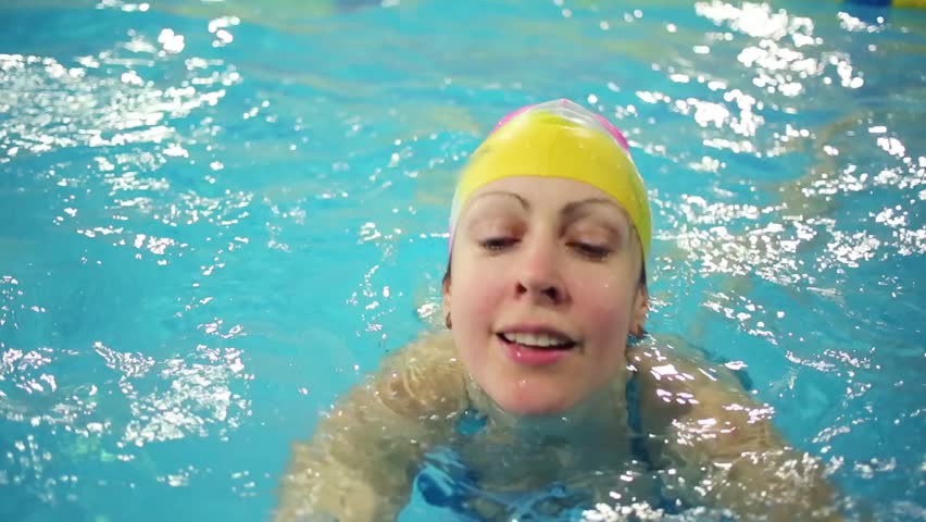 face woman swimming cap swims indoor Stock Footage Video (100% Royalty ...