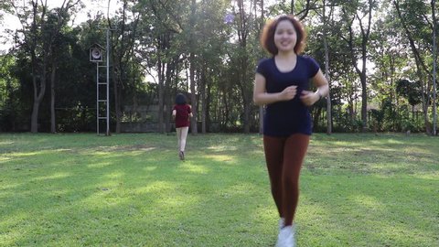 Slow Motion Young Asian Woman Running Stock Footage Video (100% Royalty ...