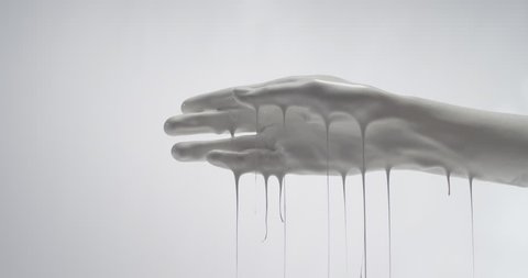 White Paint Covered Hand Dripping Slow Stock Footage Video (100% ...