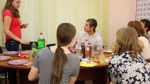 happy family sitting around kitchen table Stock Footage Video (100% ...