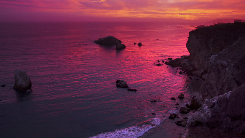 colorful sunset over ocean cliffs beach Stock Footage Video (100% ...