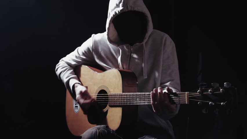 Hooded Faceless Acoustic Guitarist Playing Stock Footage Video (100% ...