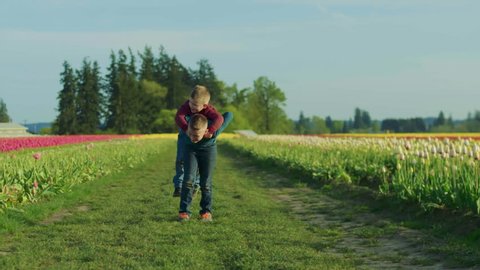 Brother Gives Little Brother Piggyback Ride Stock Footage Video (100% ...