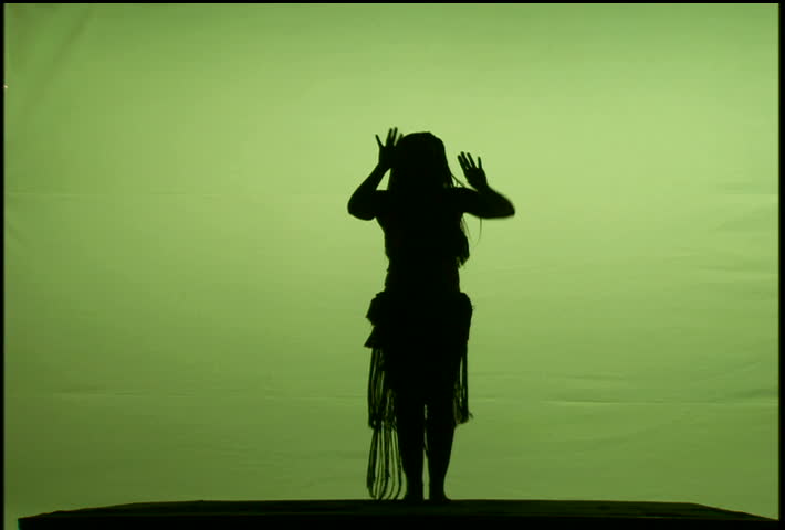 woman's silhouette dancing against green background Stock Footage Video ...