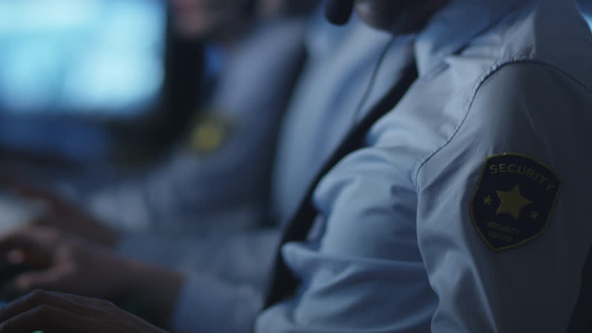 security officer talking on headset while Stock Footage Video (100% ...