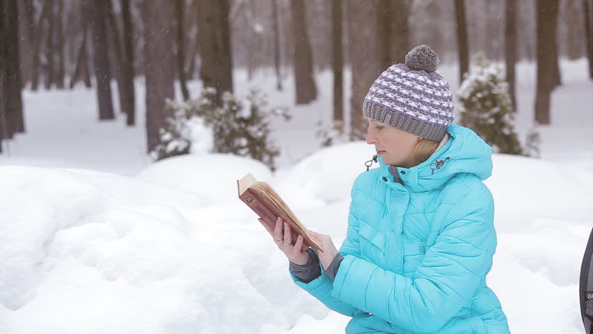 girl reading book winter garden snow Stock Footage Video (100% Royalty ...