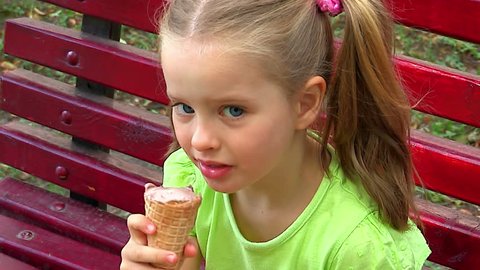Child Eating Icecream Sitting On Bench Stock Footage Video (100% ...