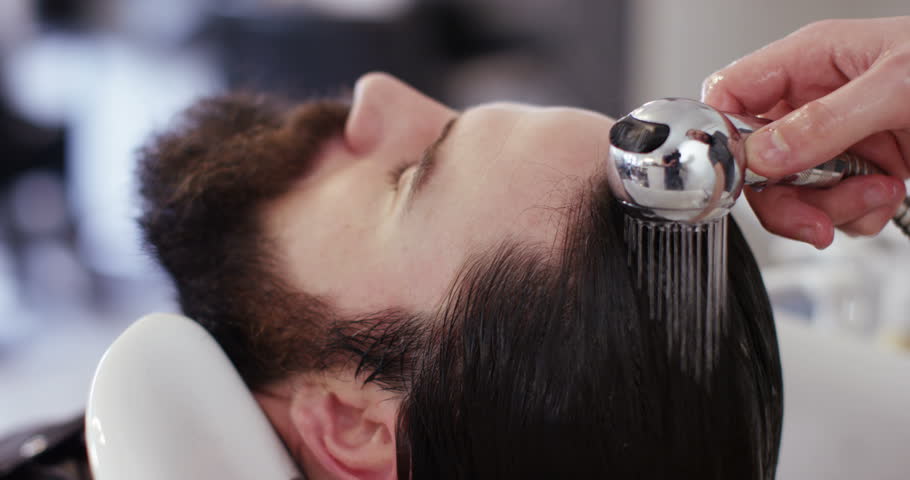 hairdresser gloves washing young woman's hair Stock Footage Video (100% ...