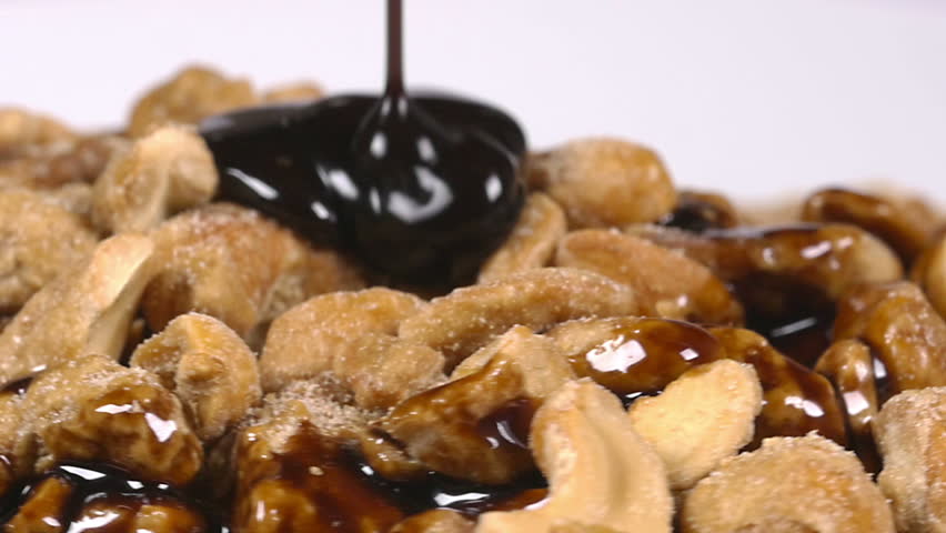 pouring delicious chocolate syrup over mixed Stock Footage Video (100% ...