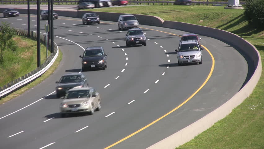 traffic comes around highway curve don Stock Footage Video (100% ...