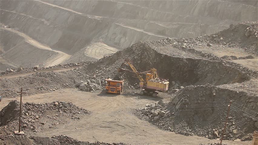 excavator loads waste rock soil into Stock Footage Video (100% Royalty ...