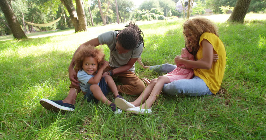 Attractive Africanamerican Family Sitting On Grass Stock Footage Video ...