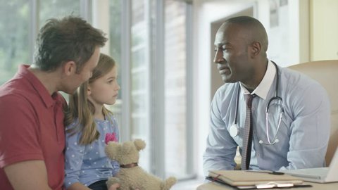 4k Friendly Doctor Talking Parent Child Stock Footage Video (100% ...