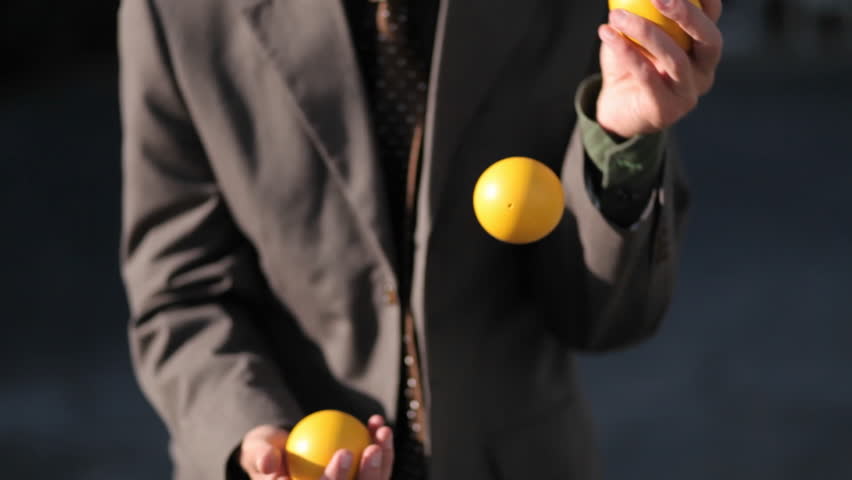 man effortlessly juggles three balls Stock Footage Video (100% Royalty ...