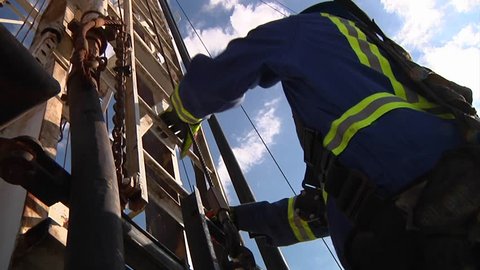 Drilling Rig Worker Climbing Derrick Wide Stock Footage Video (100% ...