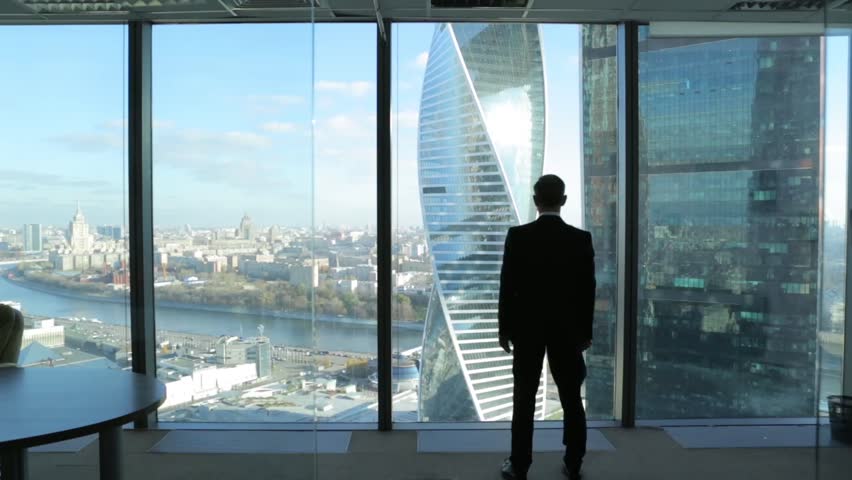 man skyscraper looking over city silhouette Stock Footage Video (100% ...