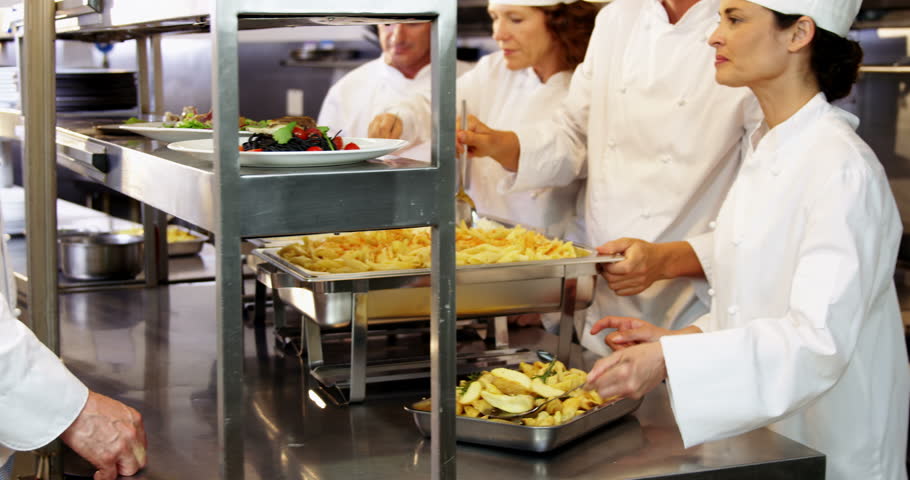 group chefs giving plates on order Stock Footage Video (100% Royalty ...